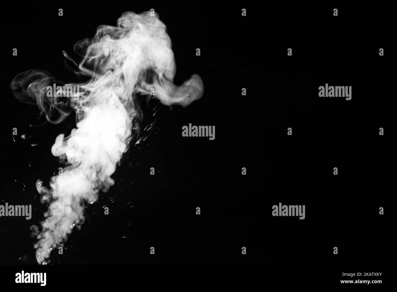 the movement of hot steam with water droplets is isolated on a black ...