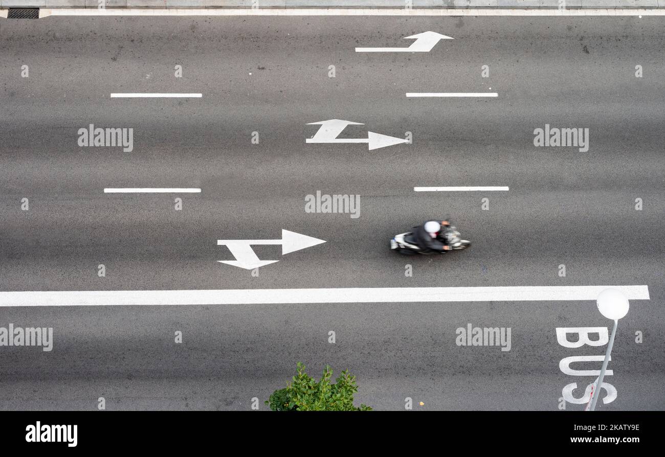 An aerial view of a biker riding on the road Stock Photo - Alamy