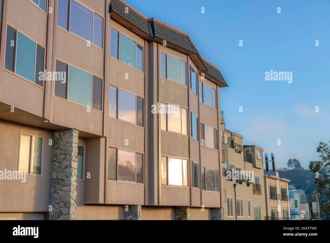 Apartment building with reflective glass windows in San Francisco,CA ...