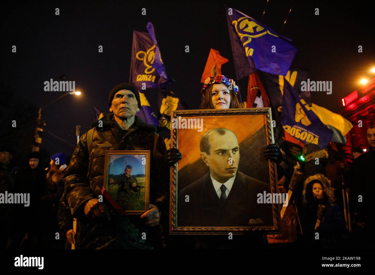 A girl carry the portrait of Stepan Bandera during the rally ...