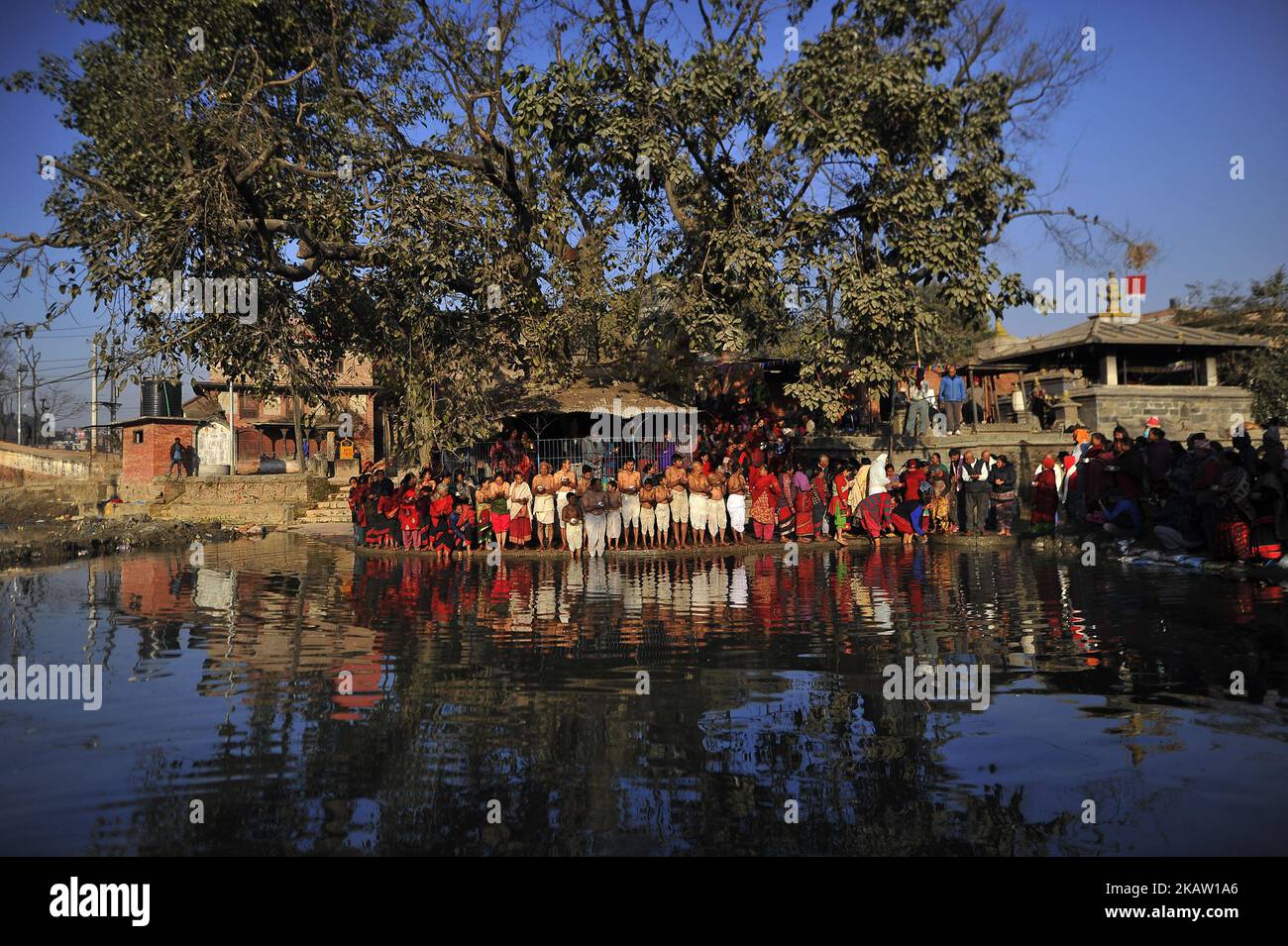 Nepalese Hindu devotees offering ritual prayer before holy Bath in ...