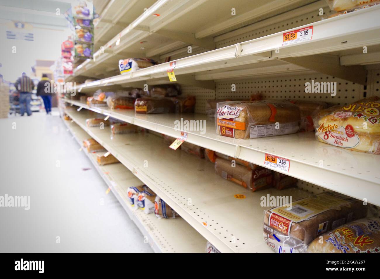 The bread isle of a Philadelphia, PA grocery store is near empty as the ...