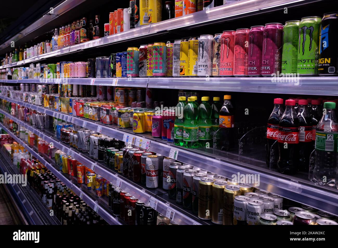 Rows of different colorful beverages in an European Asian supermarket ...