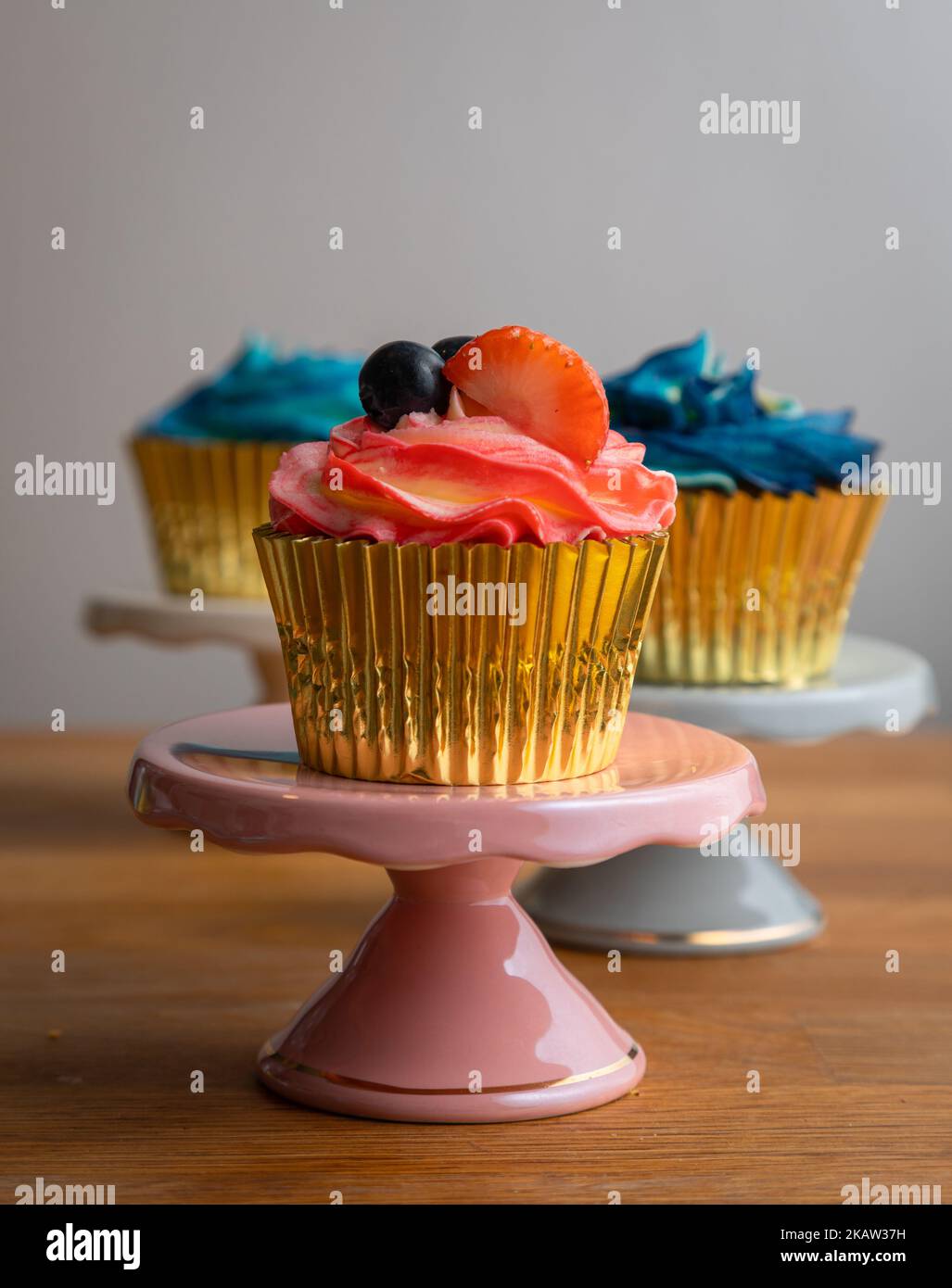 The cupcakes with blue and red frosting Stock Photo - Alamy
