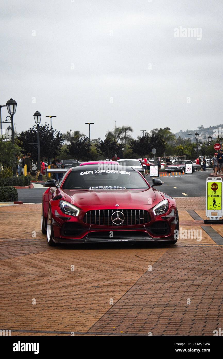 A vertical shot of the front of stunning red Wide Body Mercedes Benz ...