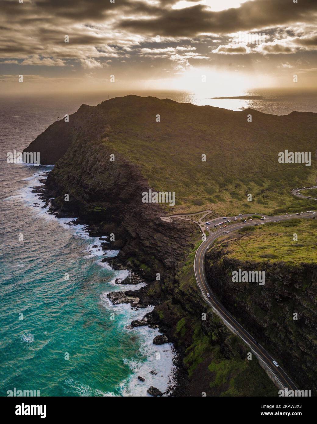 An aerial shot of mesmerizing Oahu island coastline with sun rays ...