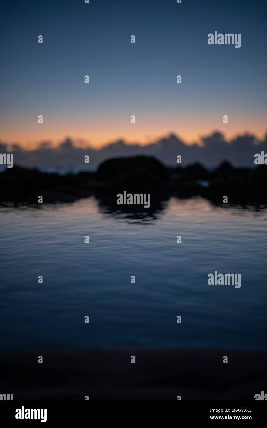 A vertical shot of the calm sea at twilight Stock Photo - Alamy