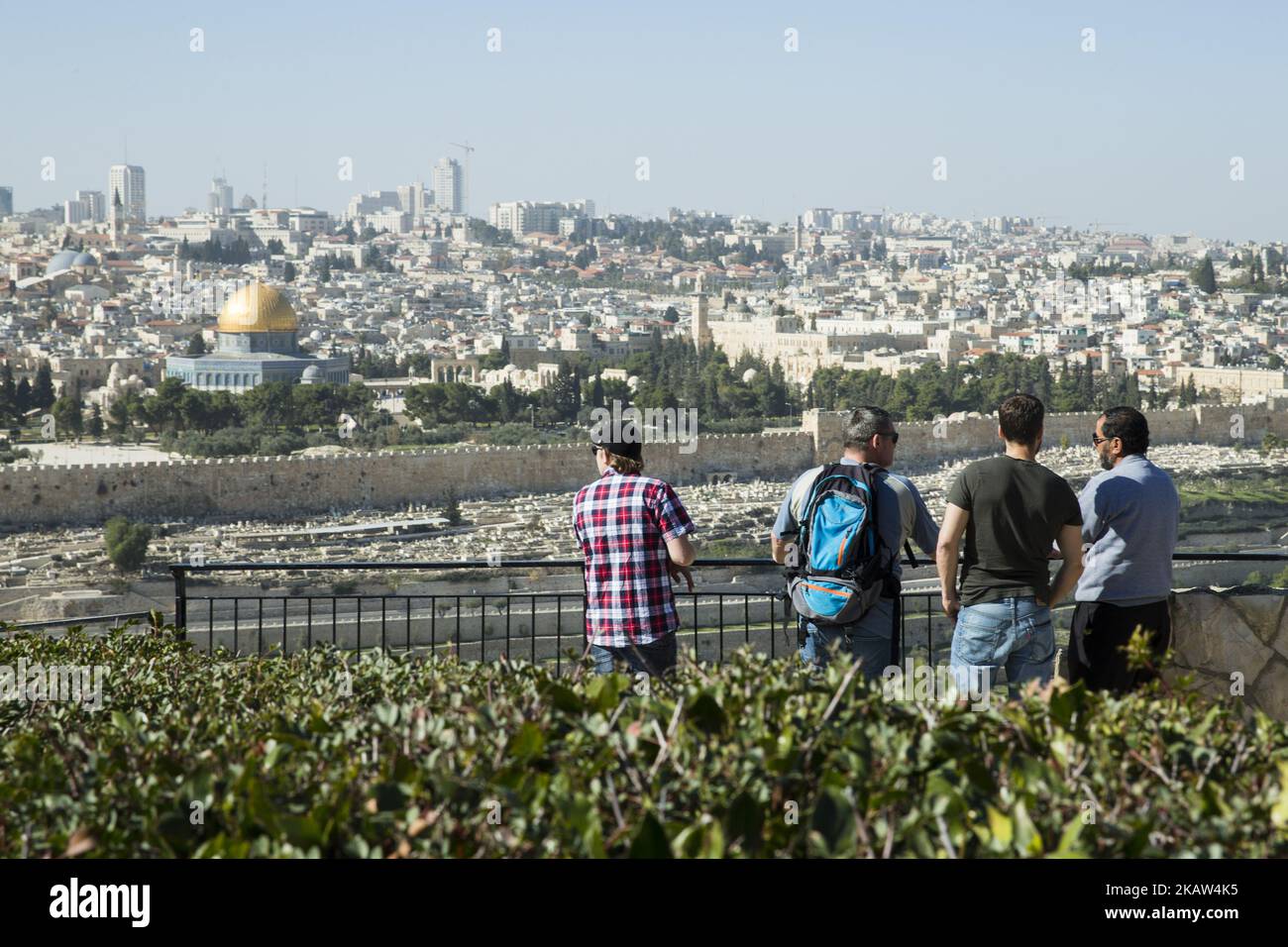 Visitors observe the view of the old city from the Mount of Olives in ...