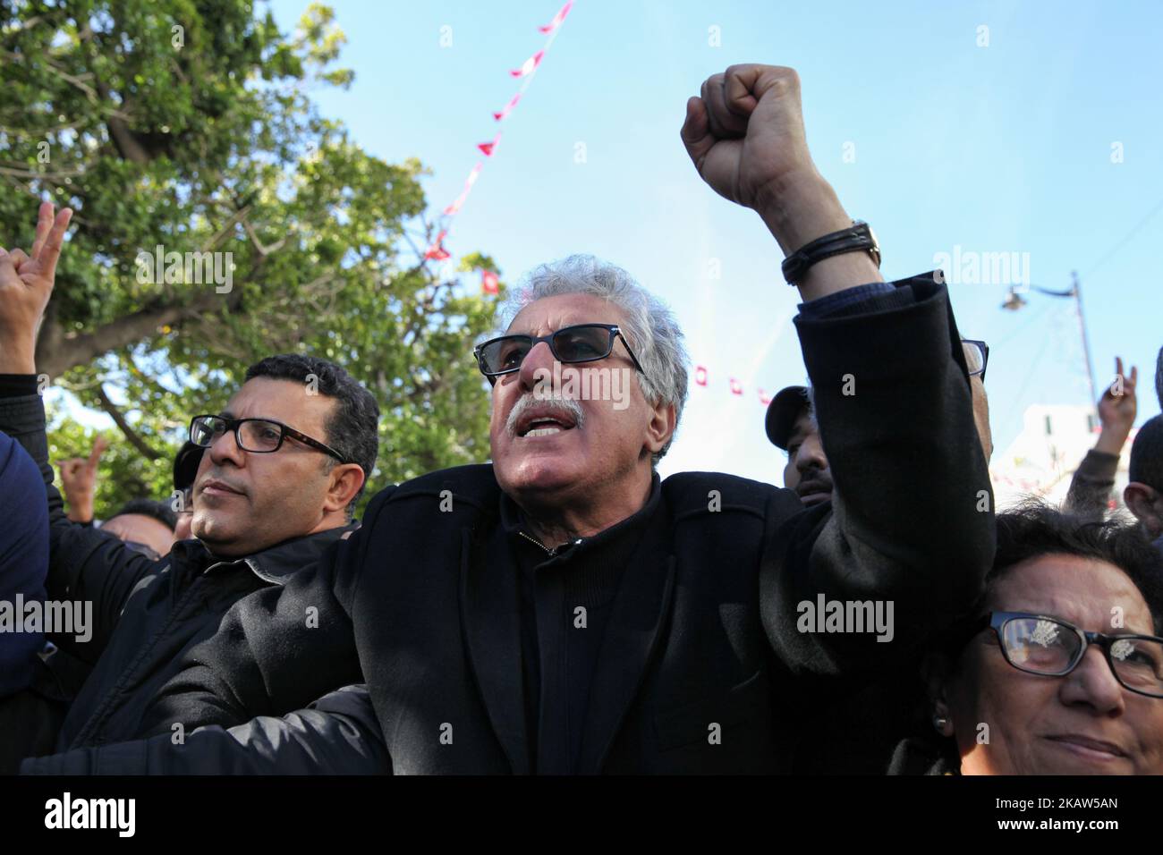 Hamma Hammami (C), leader of the Popular Front, gestures and chant ...