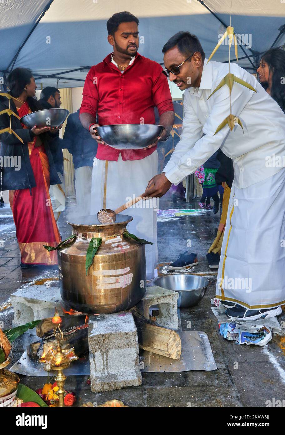 Tamil Hindus cook a traditional Pongal dish (consisting of rice cooked ...