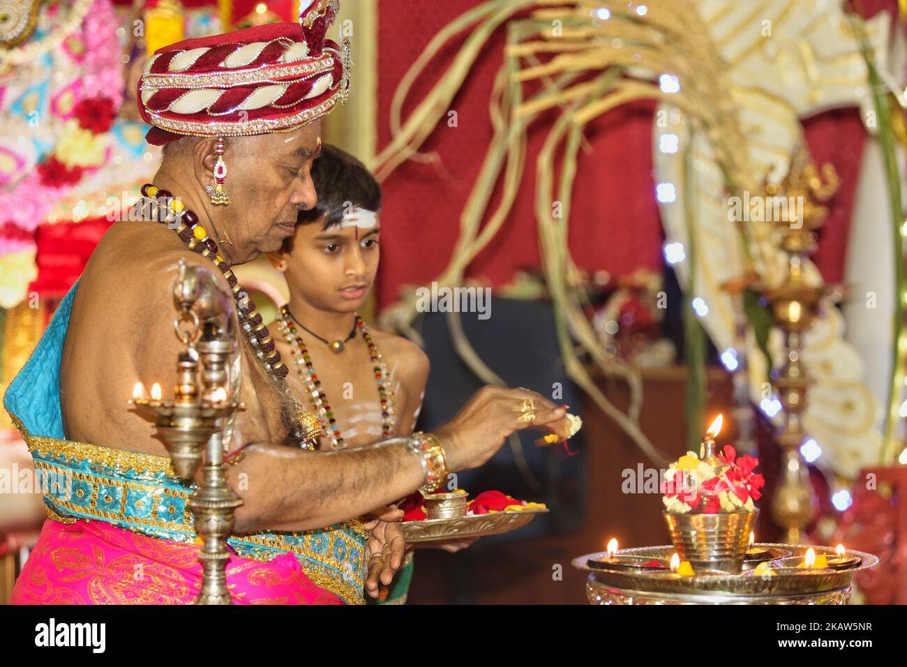 Tamil Hindu priest performs special prayers for the Sun God during the ...