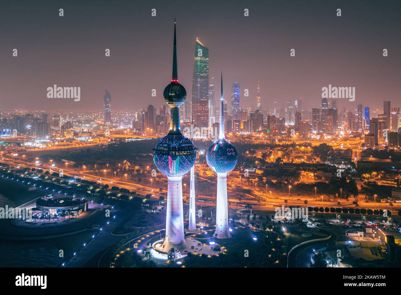 An illuminated towers with cityscape view while Kuwait City celebrating ...