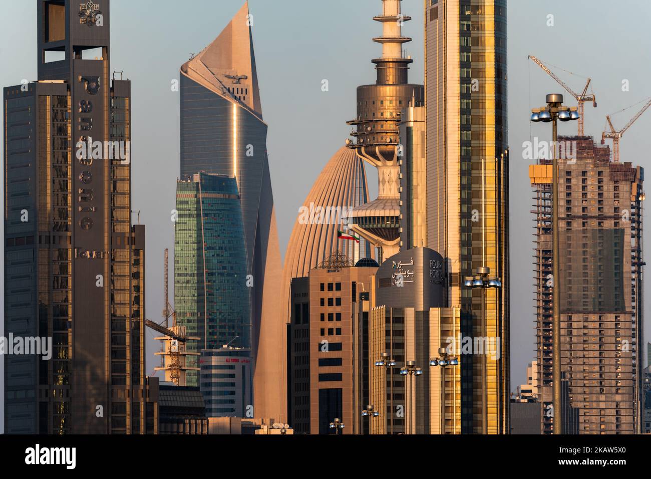 A skyline view of Kuwait City skyscrapers against the sky in Kuwait ...