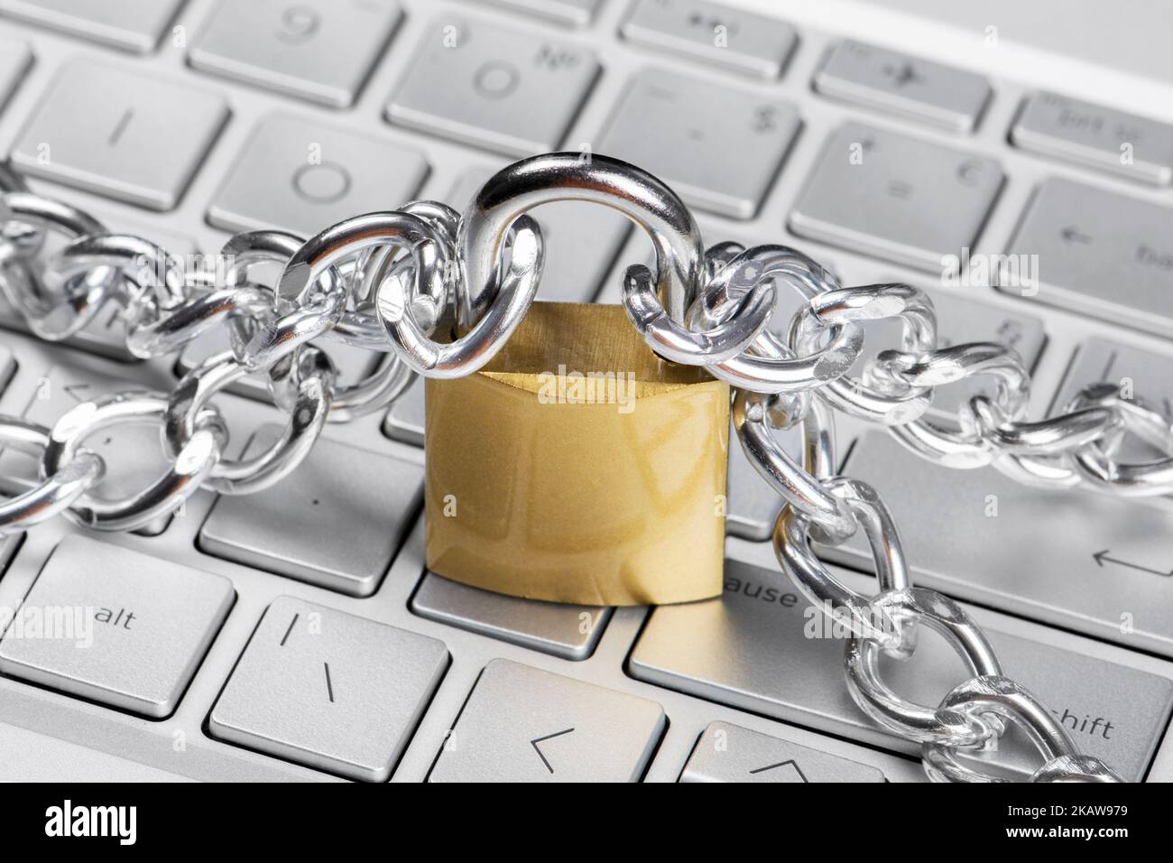 Locked chain on laptop computer keyboard. Cyber safety Stock Photo - Alamy