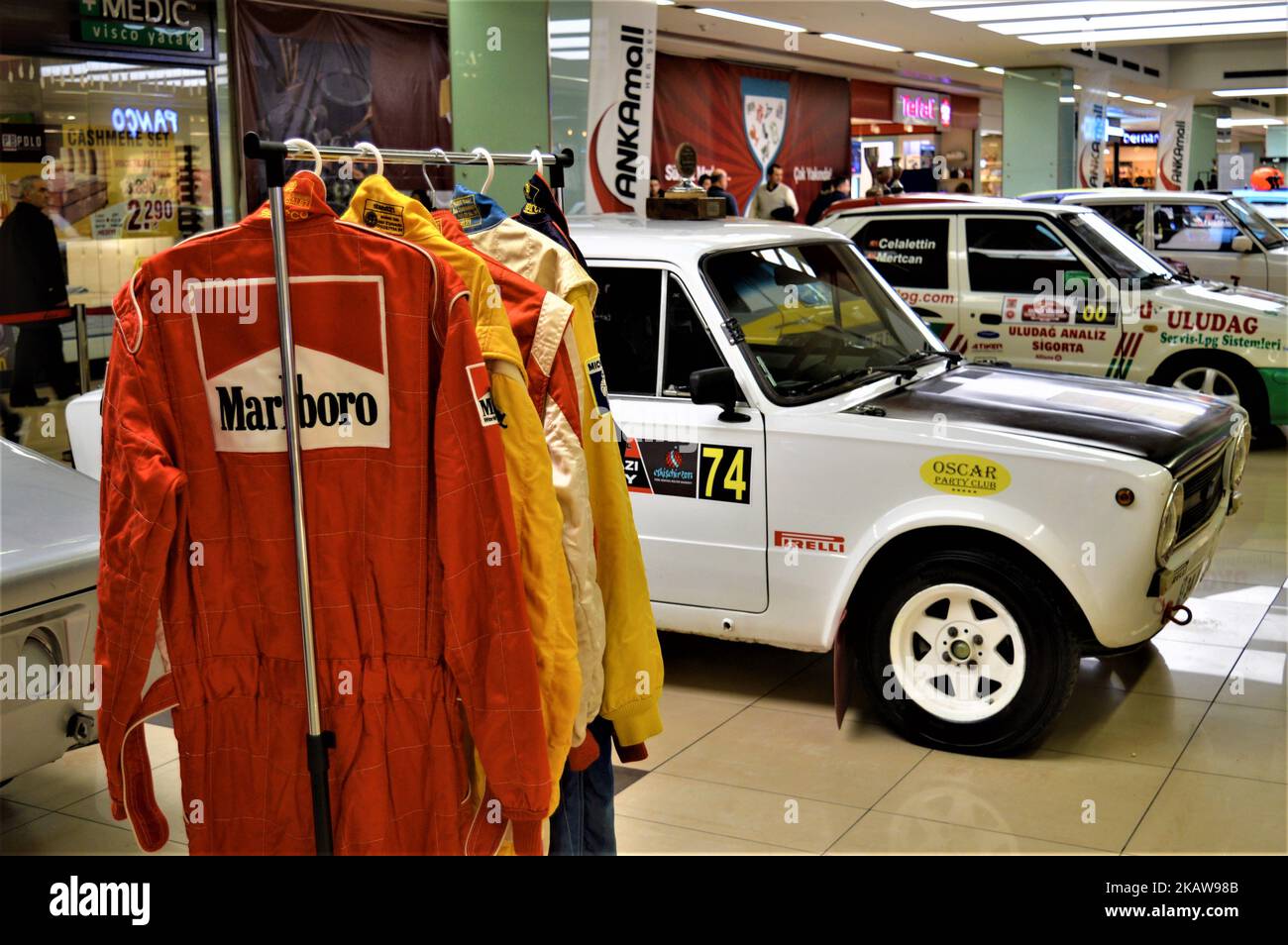 Racing automobiles and clothes are seen as retro cars, gears and ...