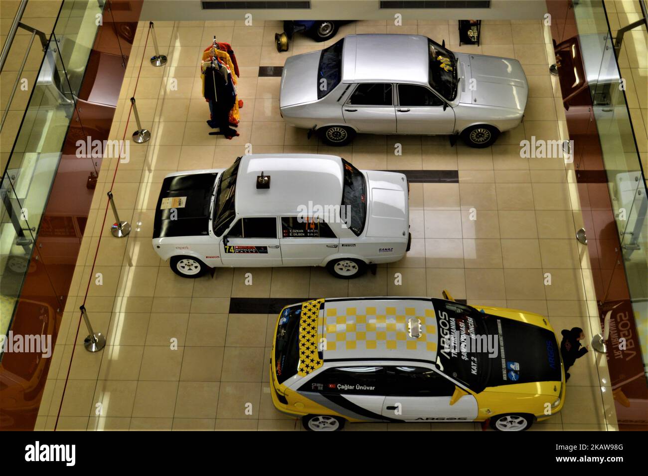 Racing automobiles are seen as retro cars, gears and equipments used by ...