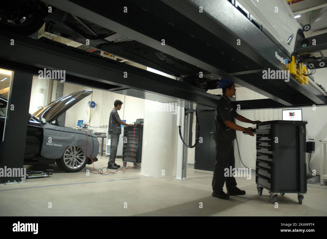 JAKARTA, INDONESIA, JAN-25: Technicians repair service vehicles and ...