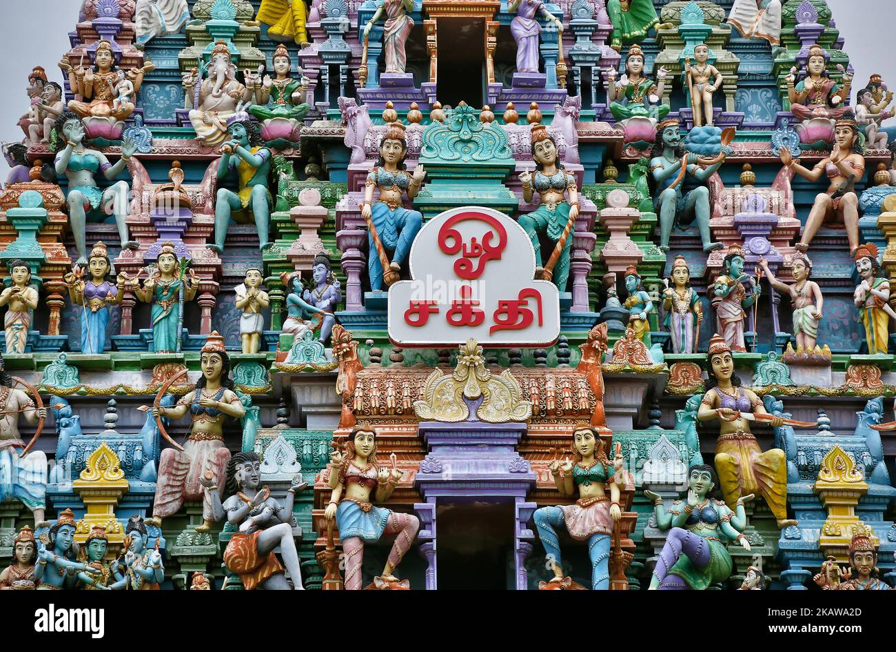 Intricate figures of Hindu deities adorn gopuram (tower) of the Sri ...