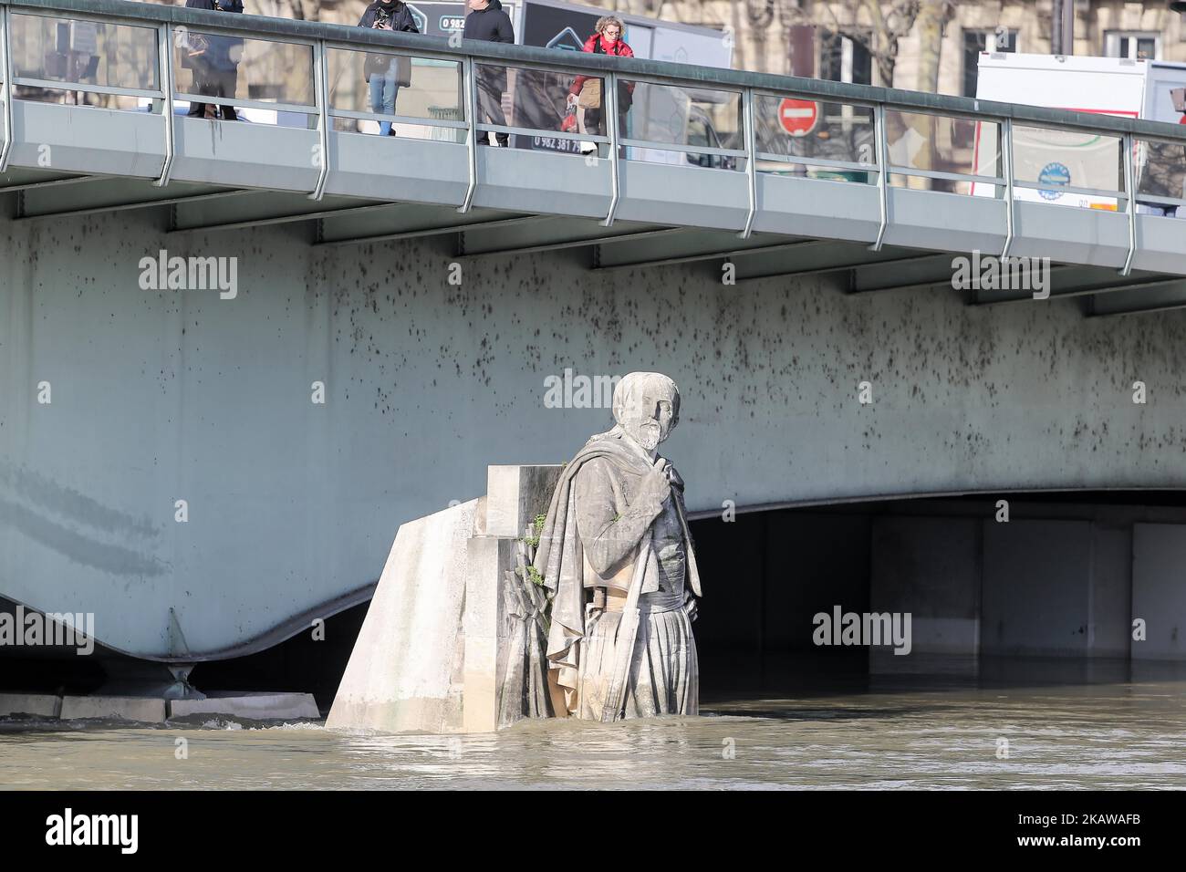 The Zouave statue at the Pont D'Alma bridge stands partially submerged ...