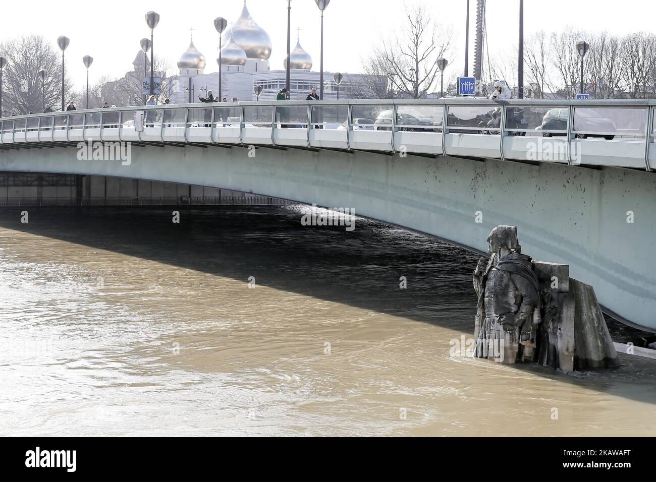 The Zouave statue at the Pont D'Alma bridge stands partially submerged ...