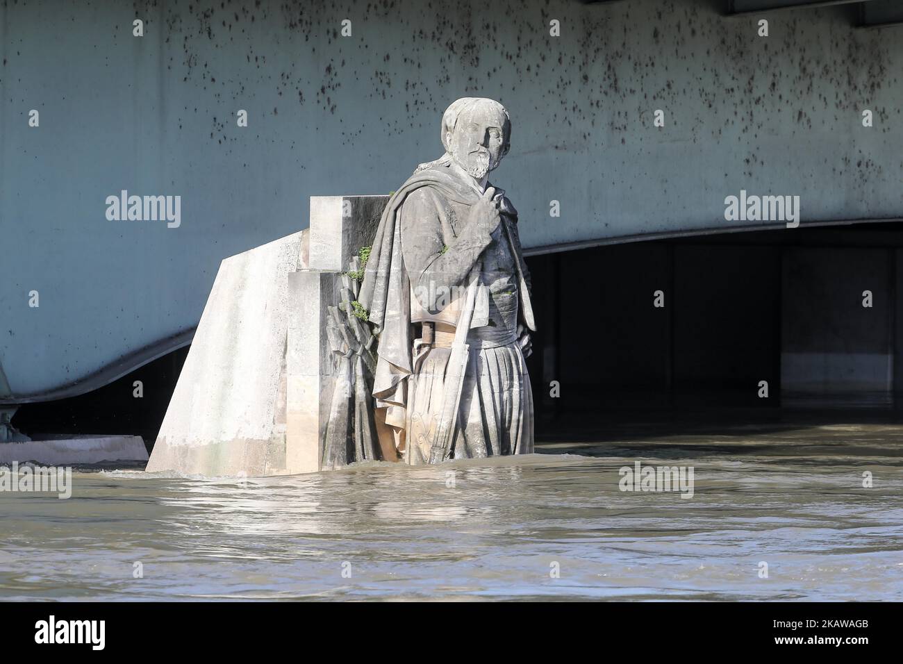 The Zouave statue at the Pont D'Alma bridge stands partially submerged ...