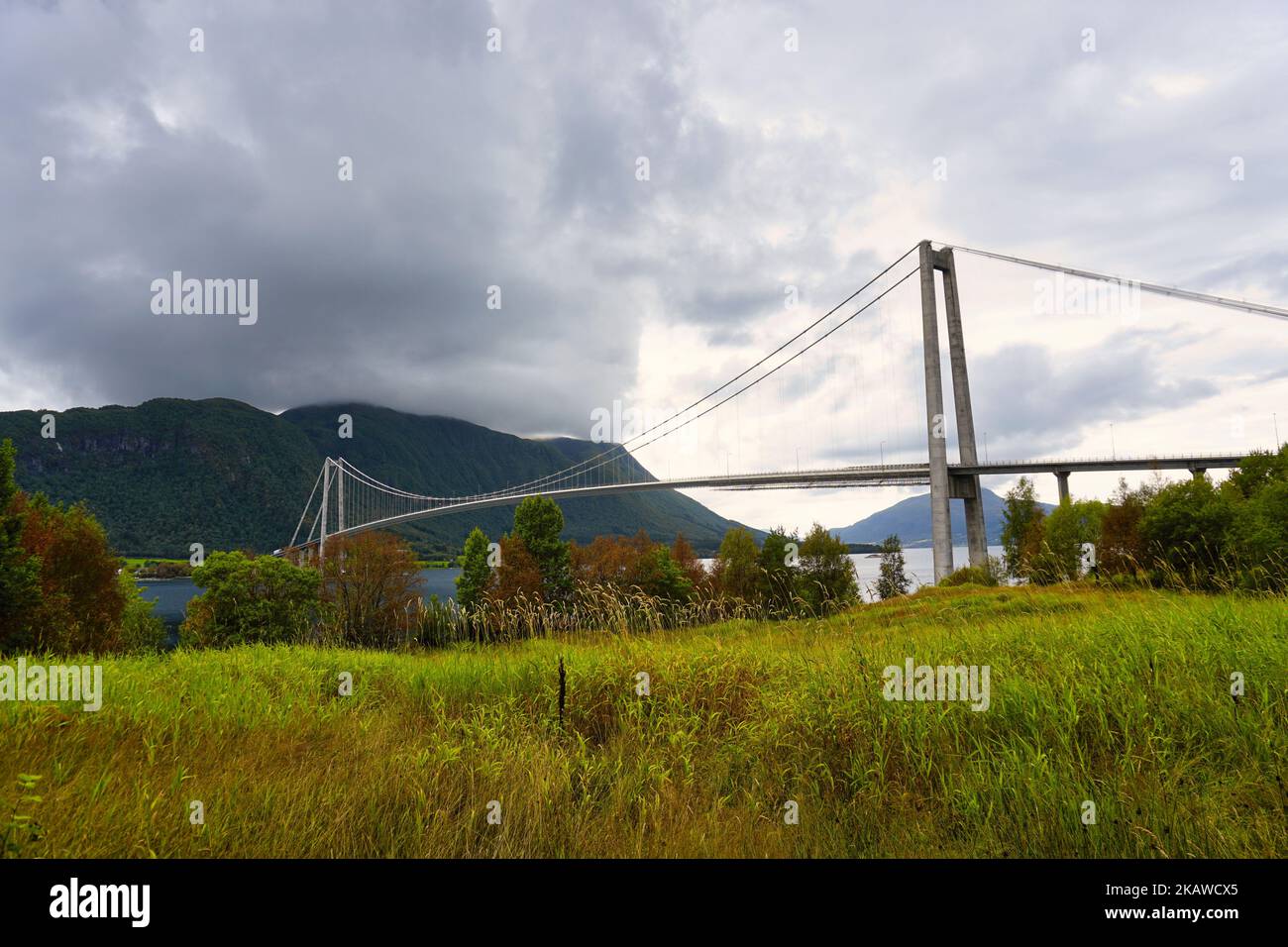 A beautiful scenery of a landscape with a huge bridge in Norway in ...