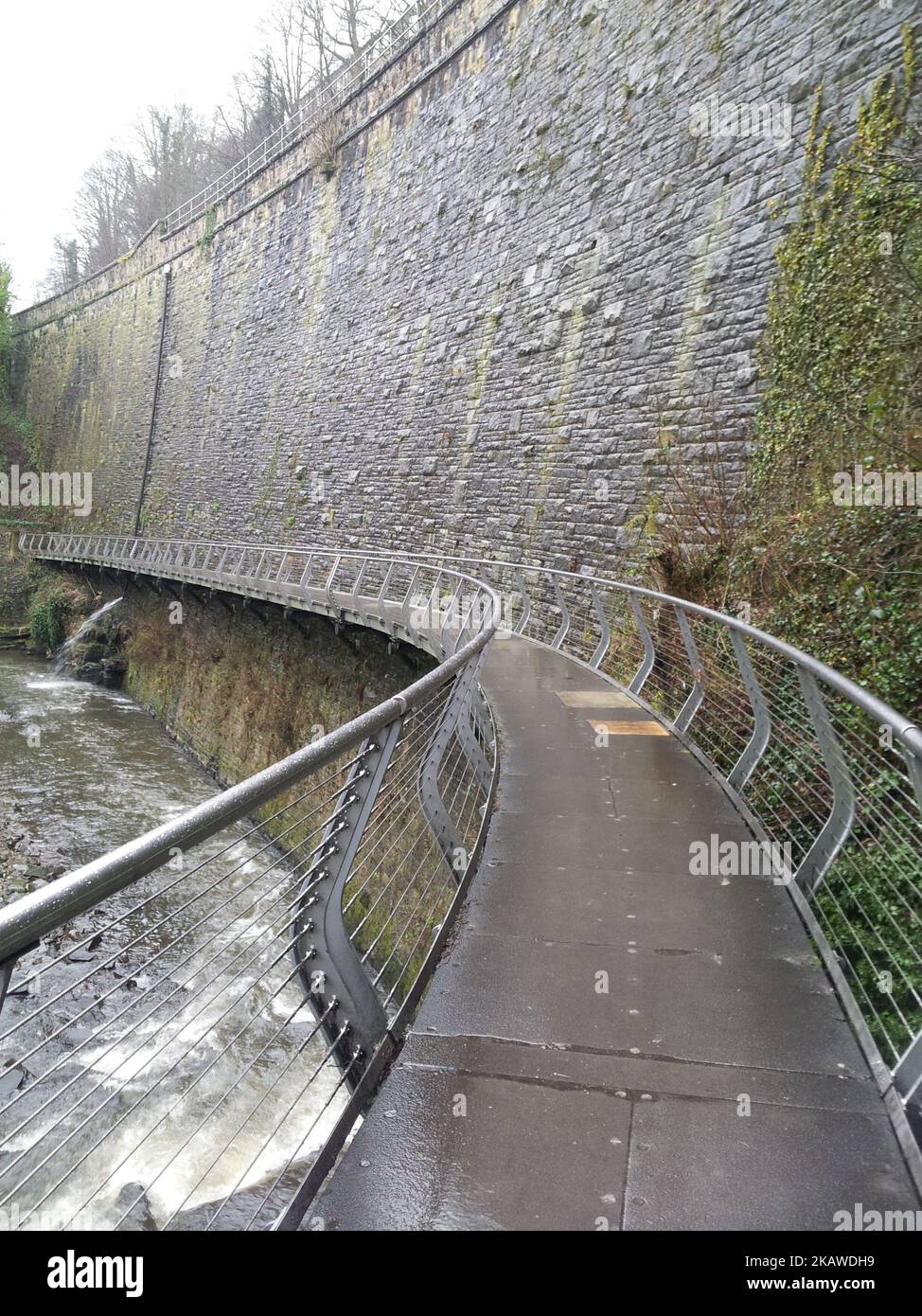The Millennium Walkway with flowing Goyt river below in Torrs Riverside ...