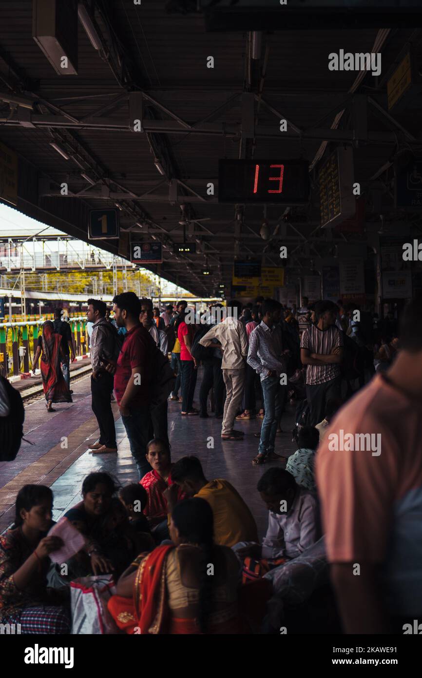 A vertical sot of Southeast Asian people on a railway station in Indore ...