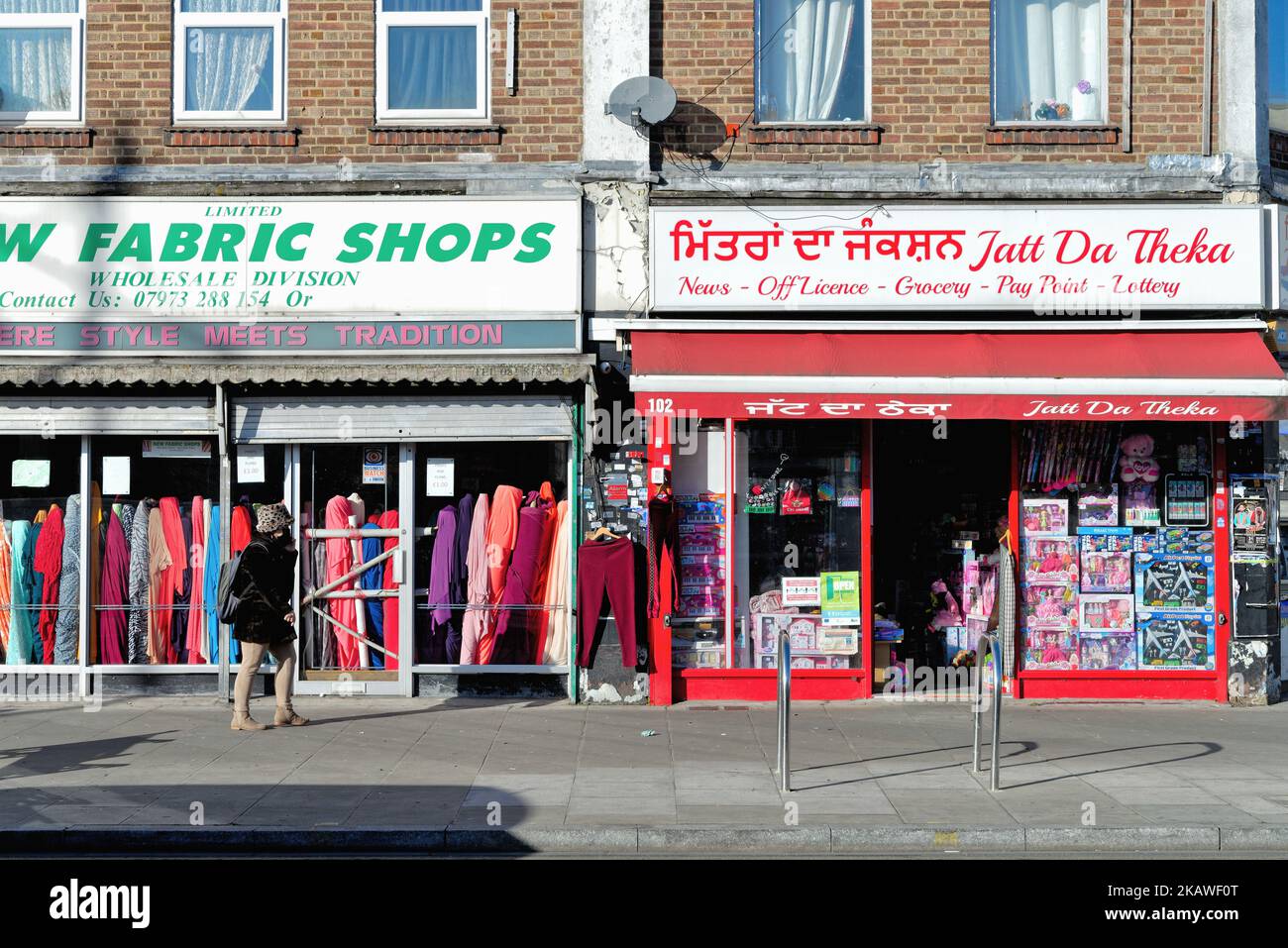Colourful multicultural shop fronts in Southall Greater London England ...