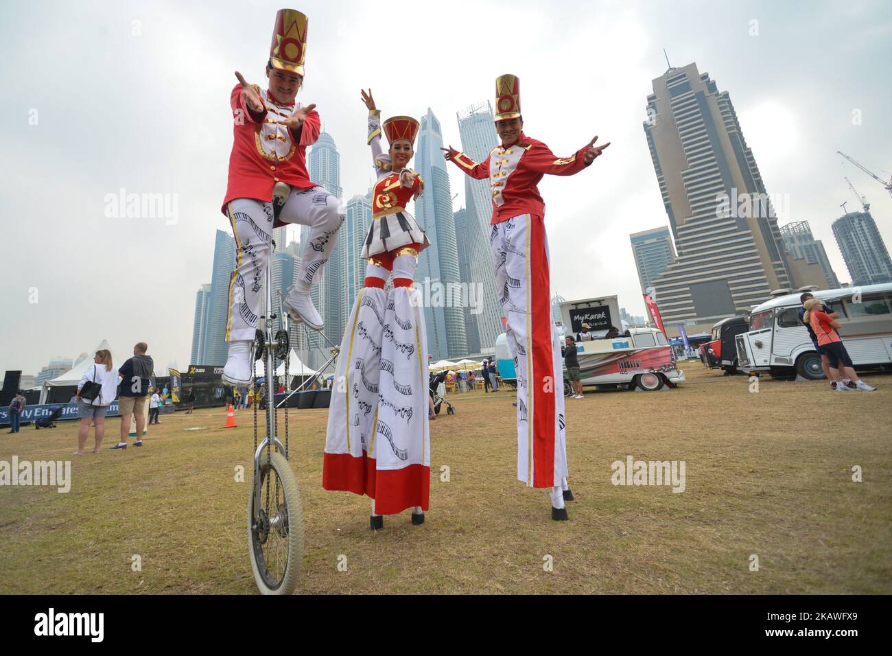Members of the marching band pose for a picture ahead of the start to ...