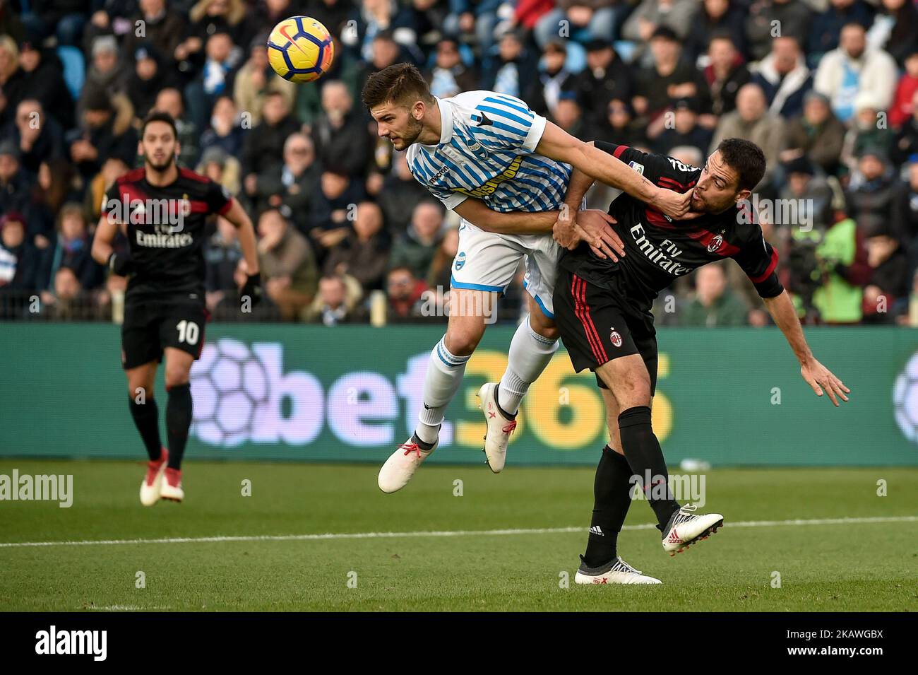 Lorenco Simic of SPAL challenges Giacomo Bonaventura of Milan during ...