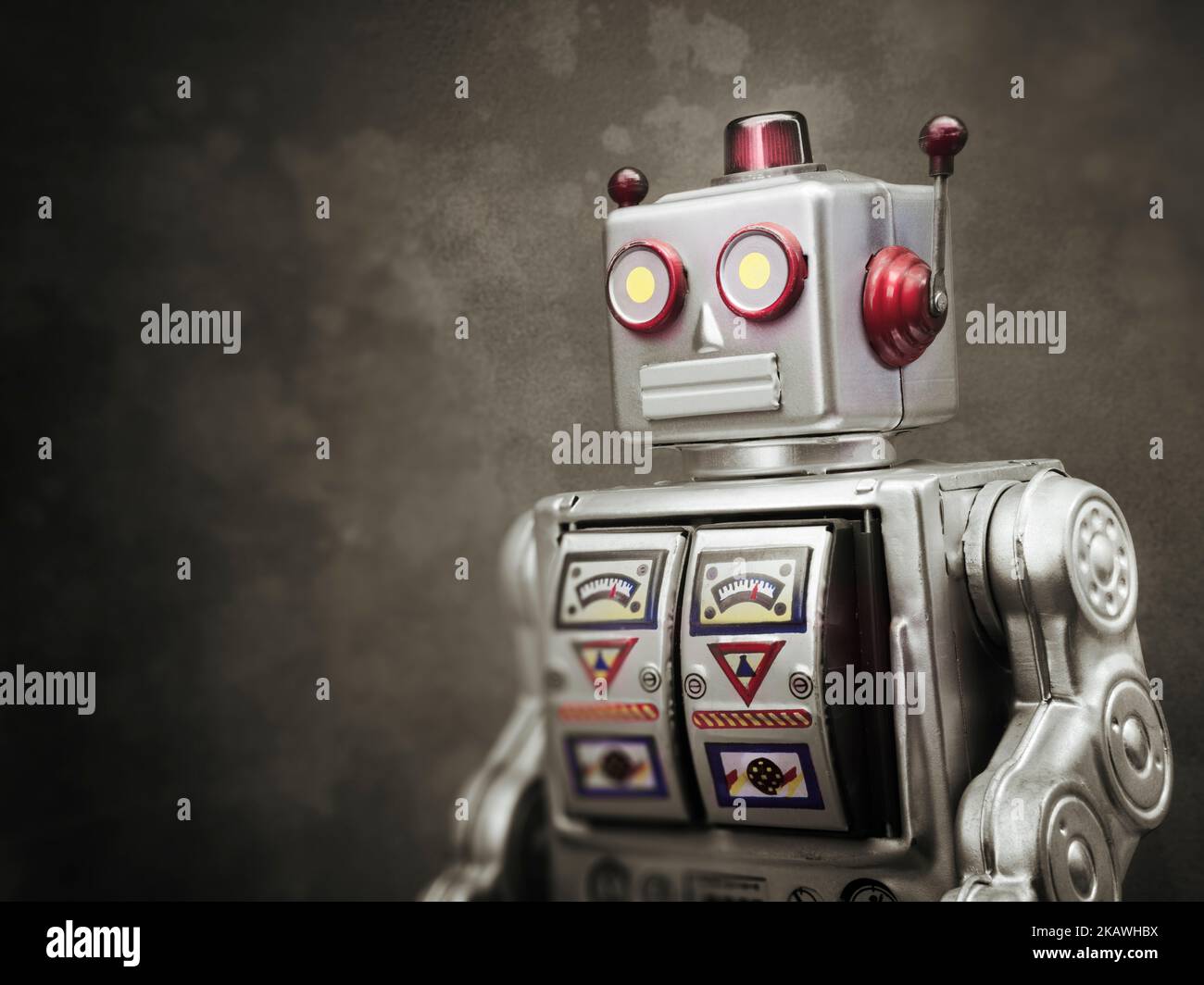 toy robot on a grey background Stock Photo - Alamy