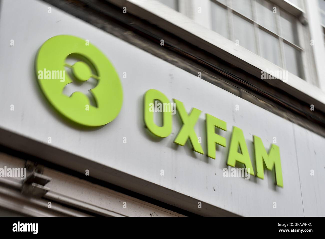 An Oxfam sign is pictured outside a charity bookshop in central London ...