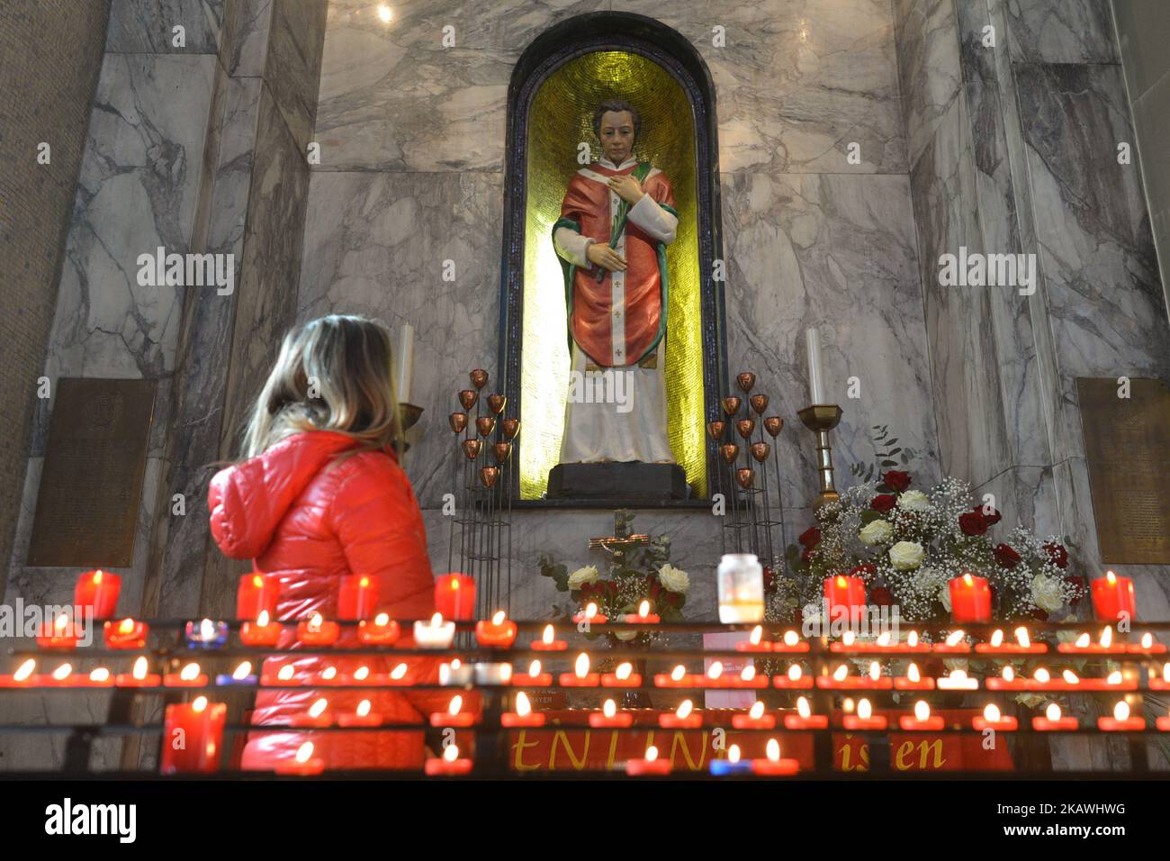 People visit the chapel with the statue of patron saint of love, St ...