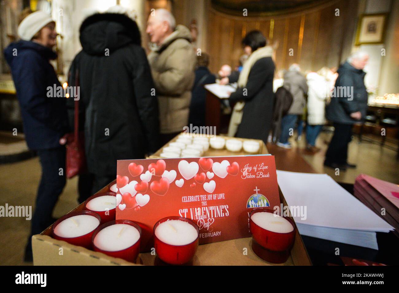 A view of celebrations candles and cards at the chapel with the statue ...