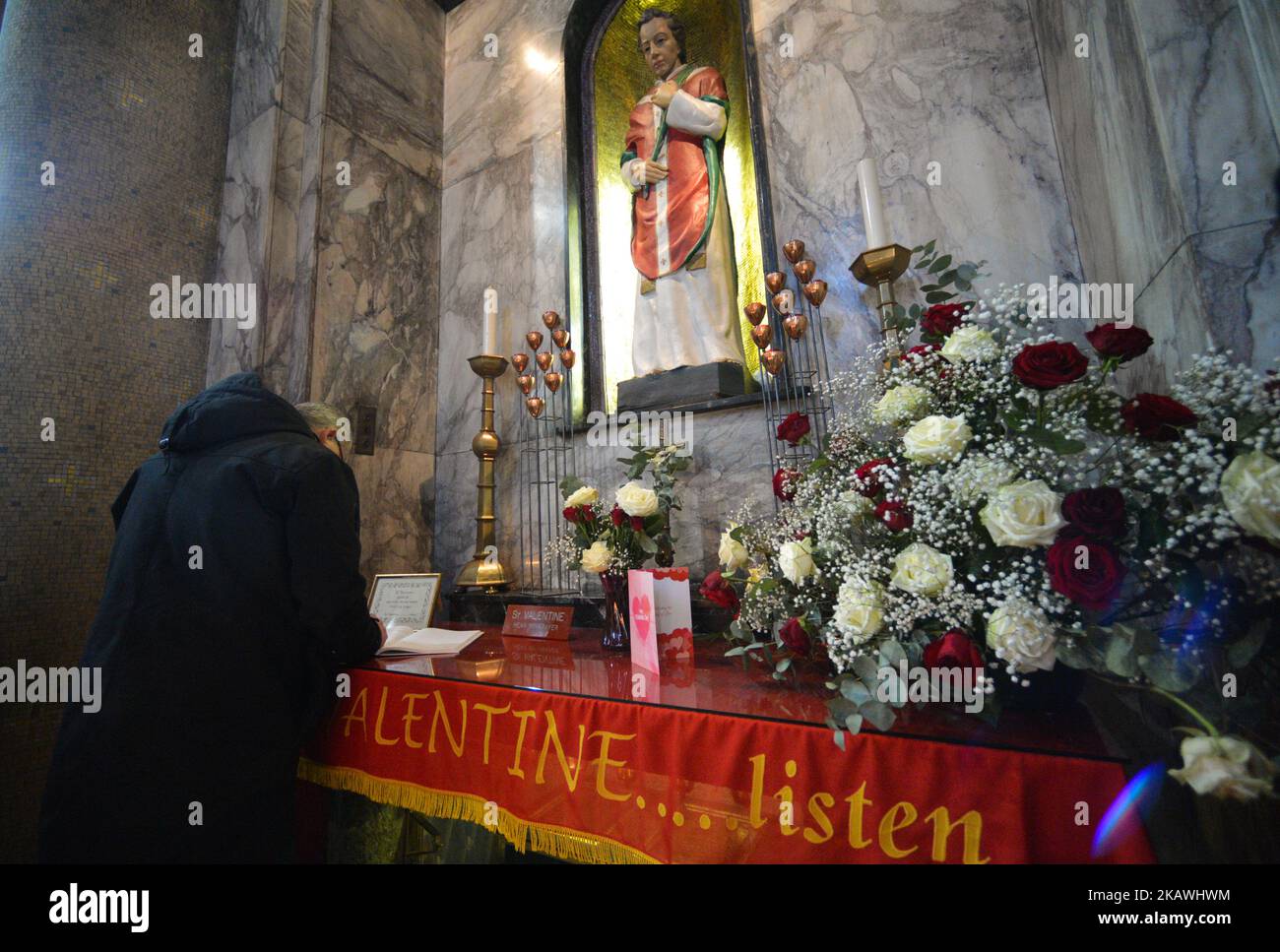 People visit the chapel with the statue of patron saint of love, St ...