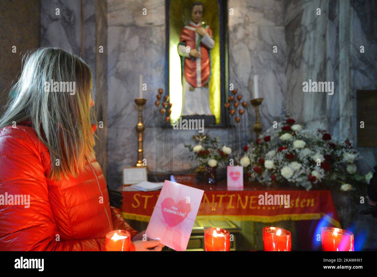 People visit the chapel with the statue of patron saint of love, St ...