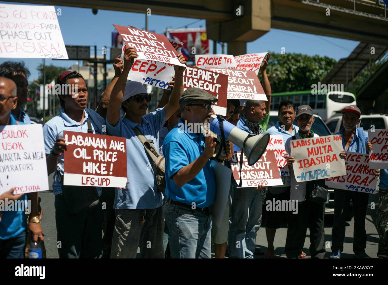 Jeepney drivers belonging to the activist jeepney driver group PISTON ...
