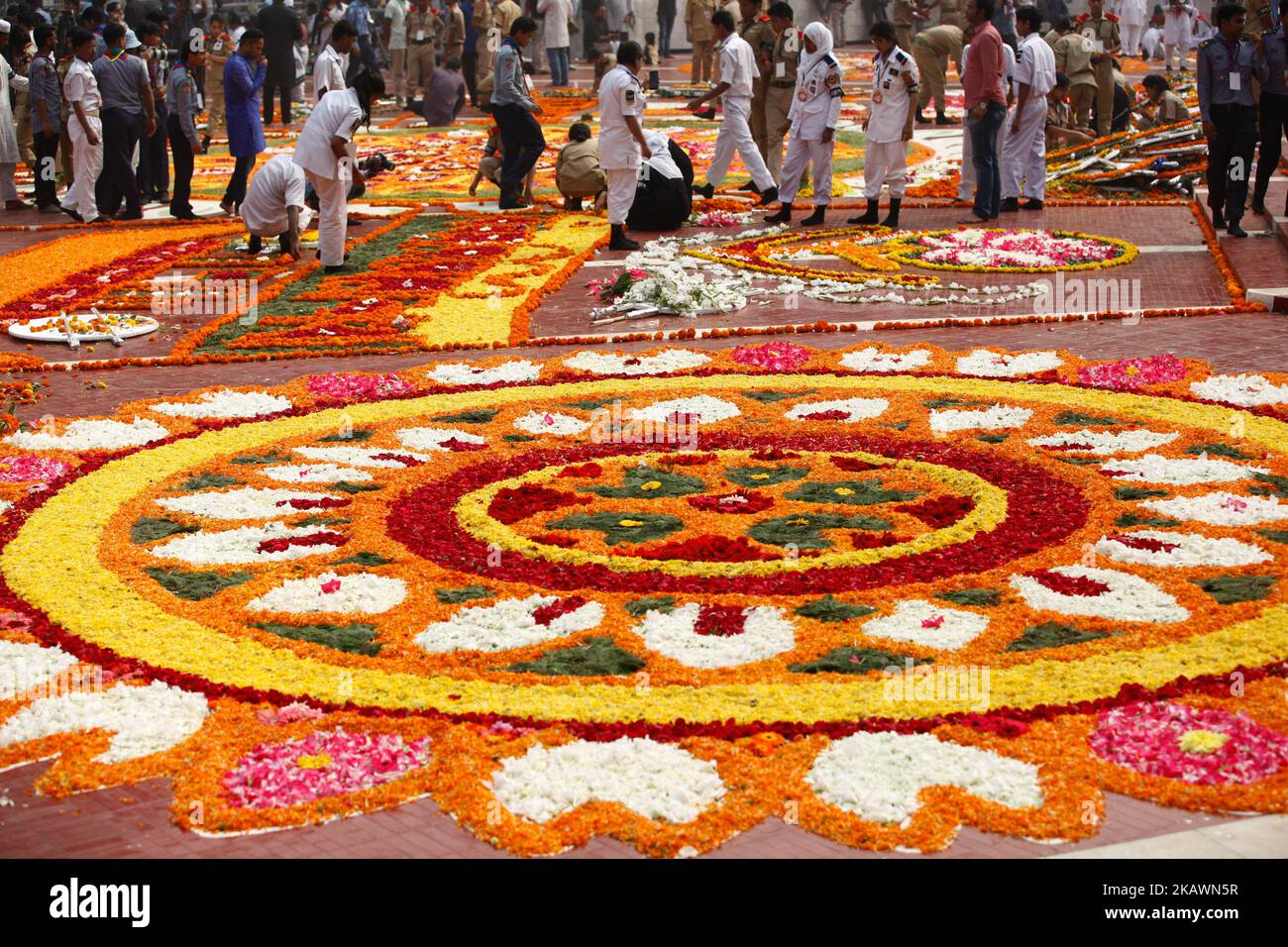 Bangladeshi girls decorates the Dhaka Central Shaheed Minar, or Martyr ...