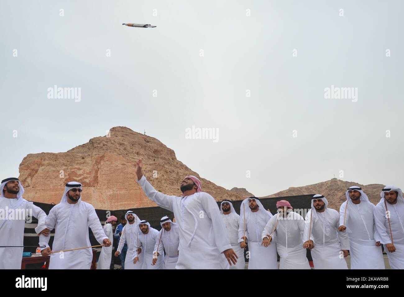 A group of local men perform the 'stick dance', a traditional ...