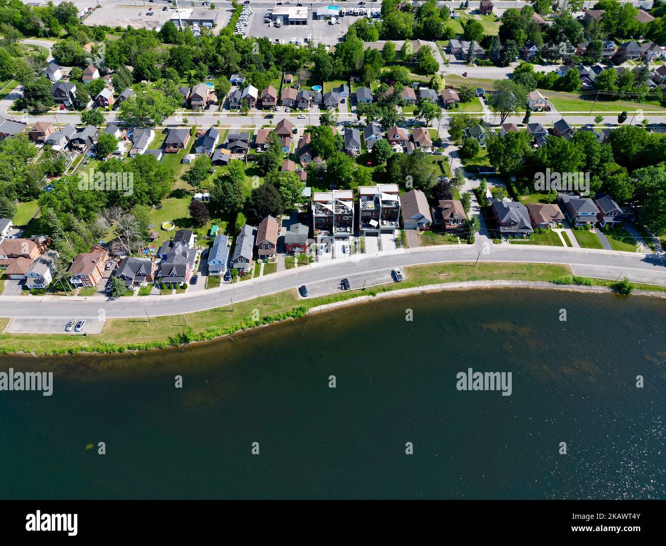 An aerial view over peaceful riverbank and Peterborough city, Ontario ...