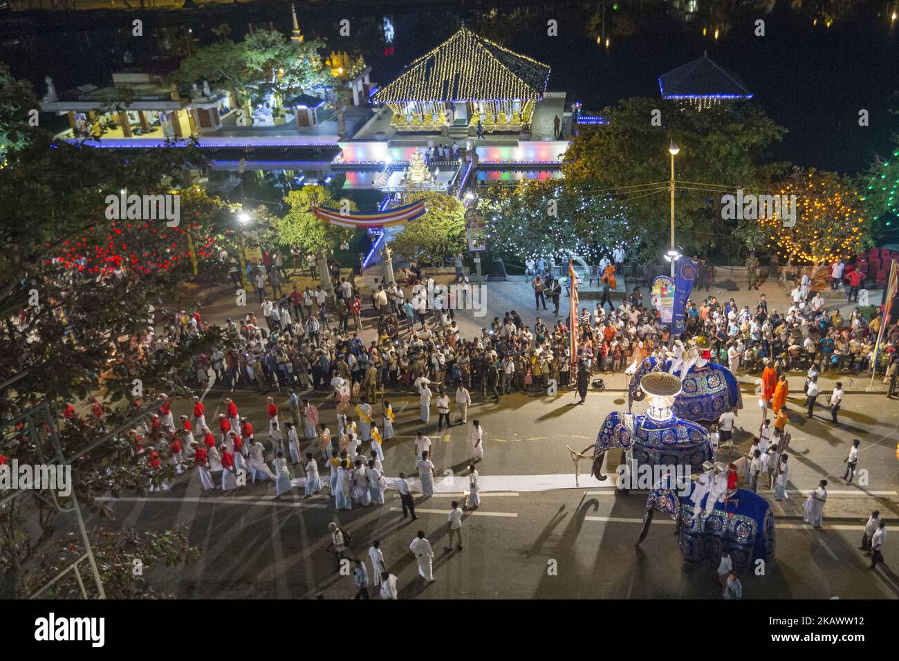 The sacred Buddhist relic casket is carried out by an elephant led by ...