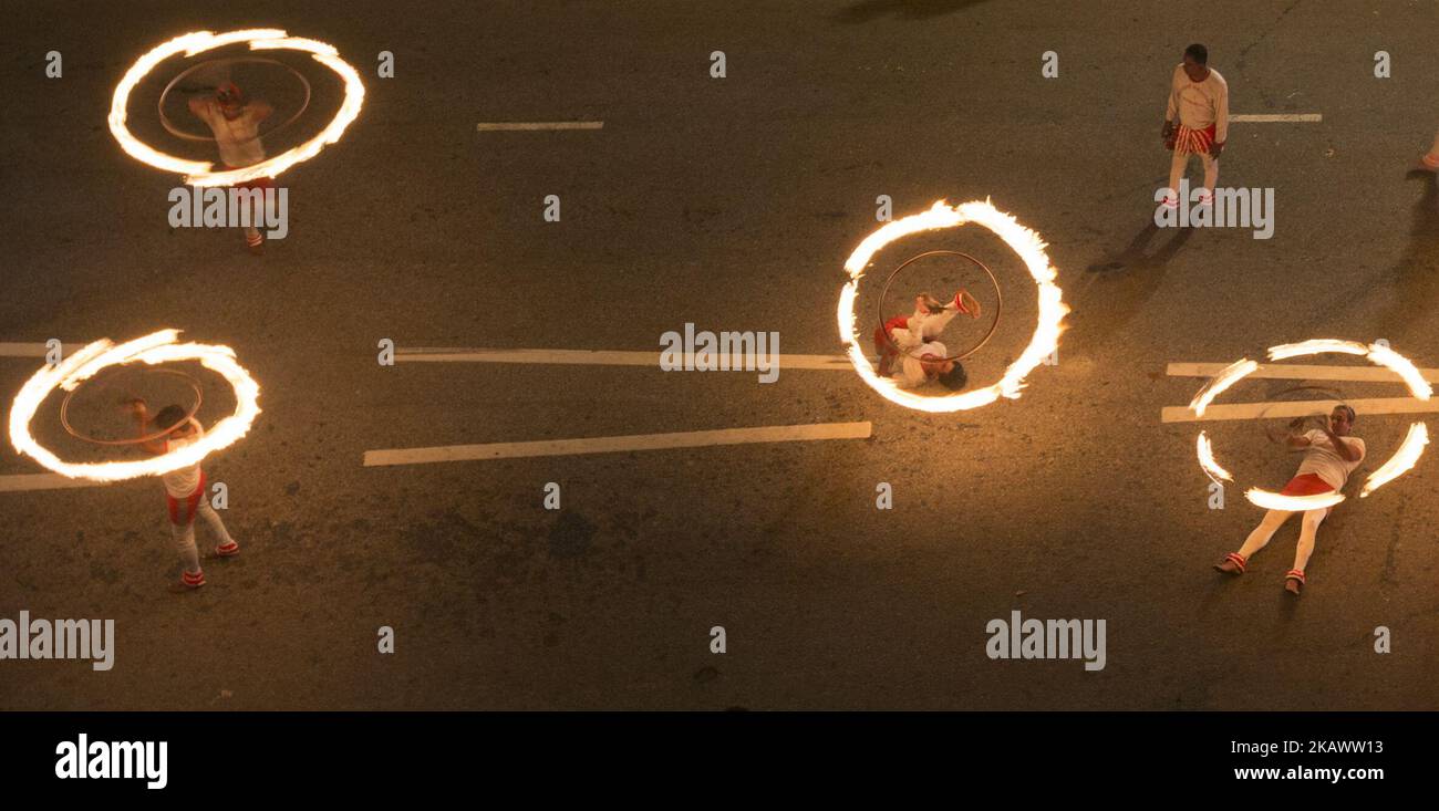 Sri Lankan fire dancers perform during the Navam perahera, the Annual ...