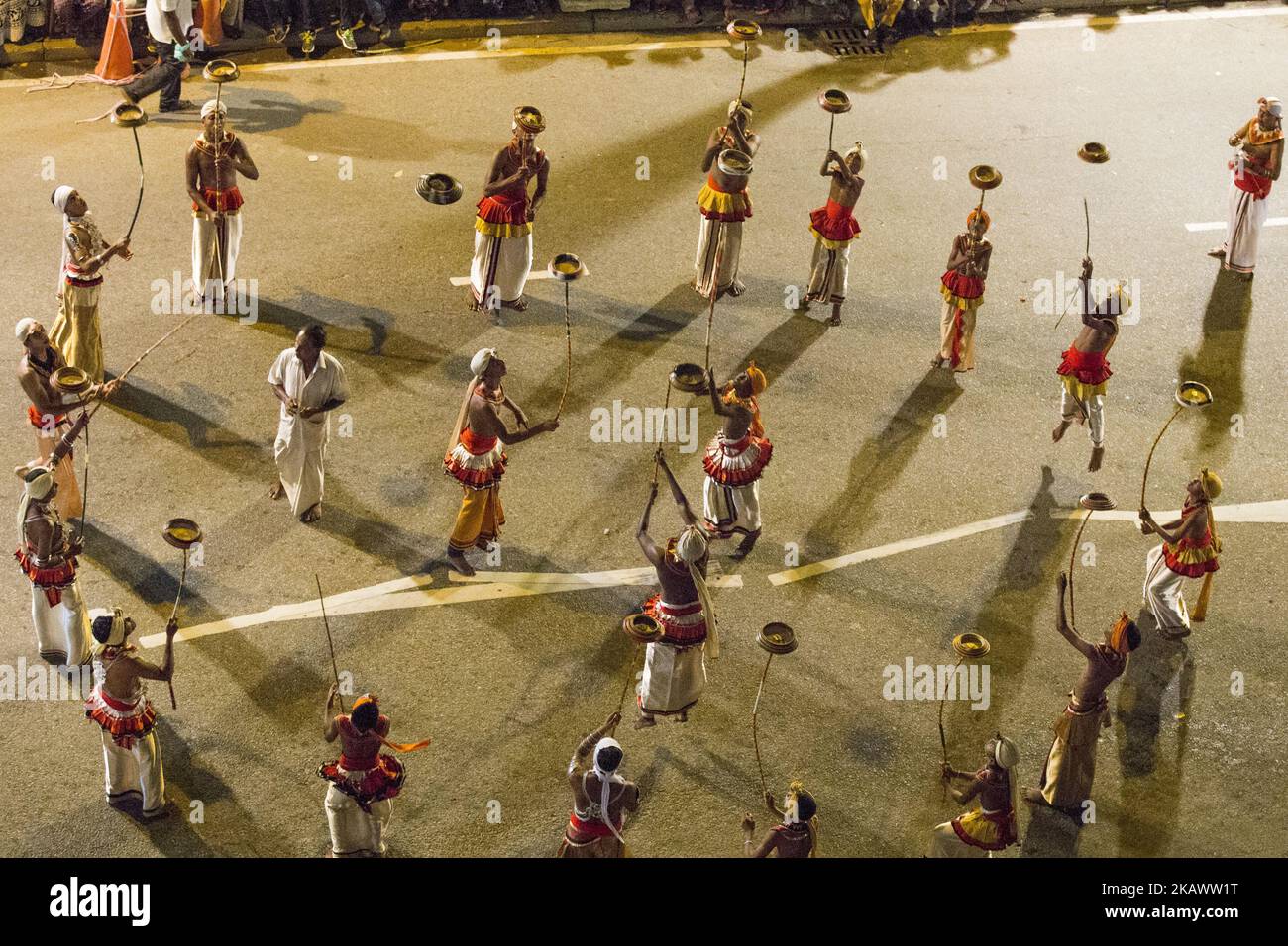 Sri Lankan traditional dancers perform during the Navam perahera, the ...