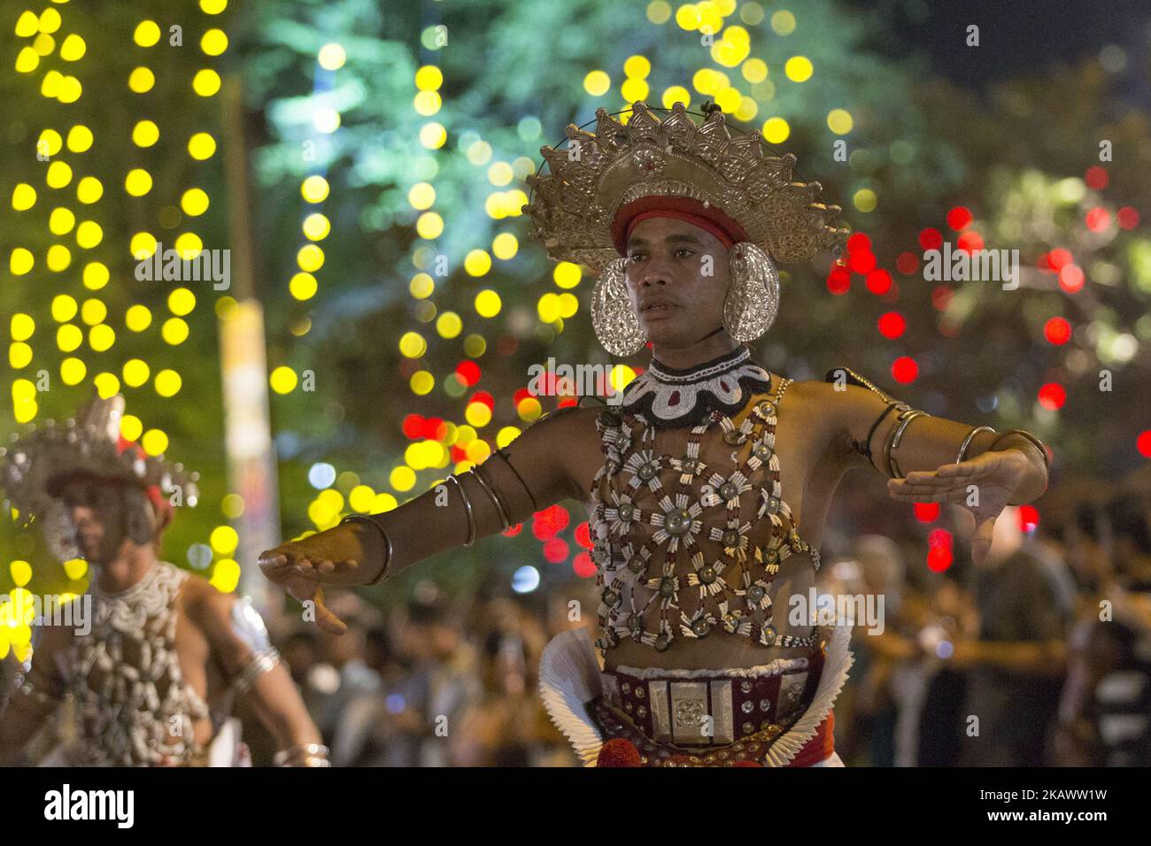 Sri Lankan traditional dancers perform during the Navam perahera, the ...