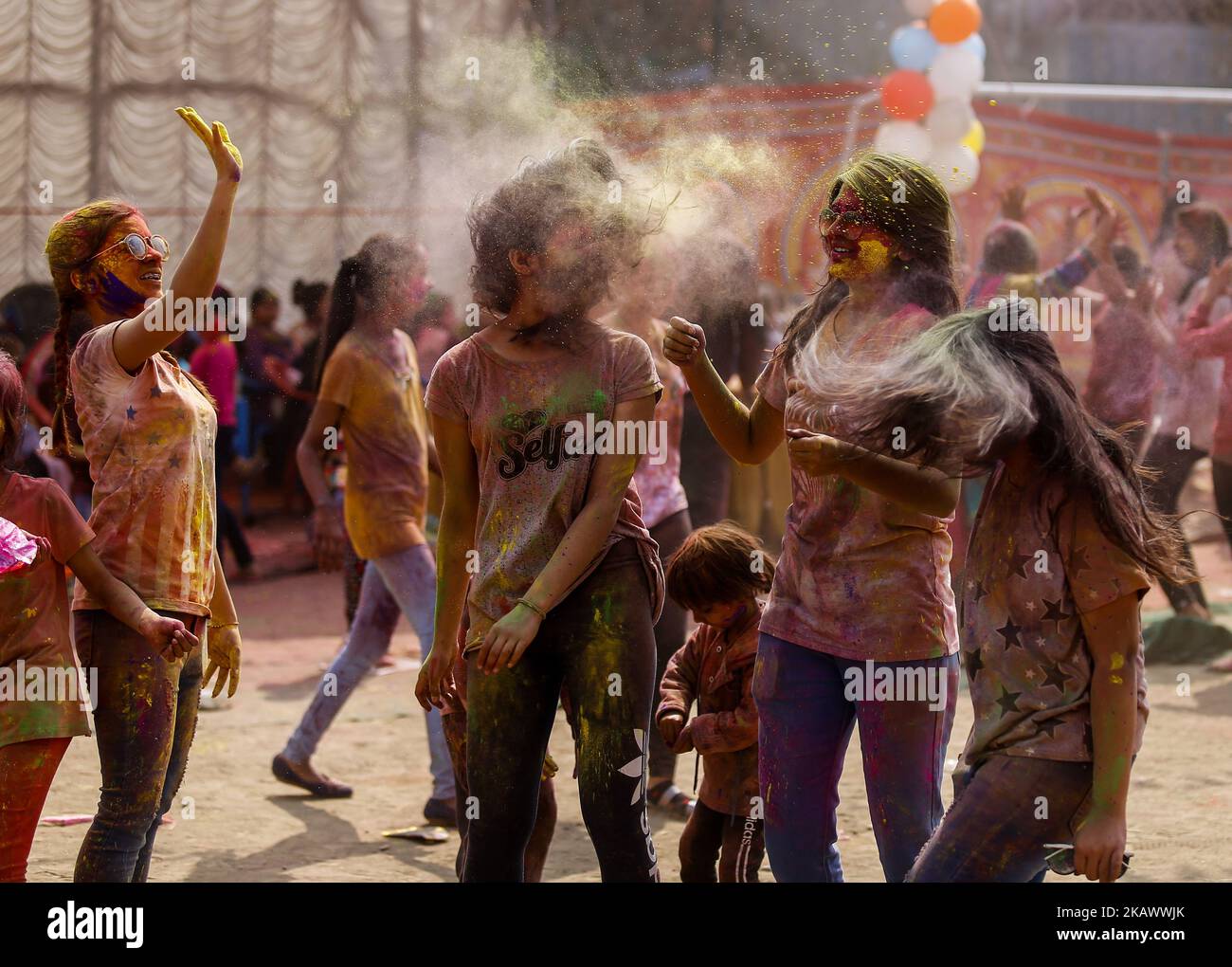 Nepalese play with colour powder as they celebrate Holi festival in ...