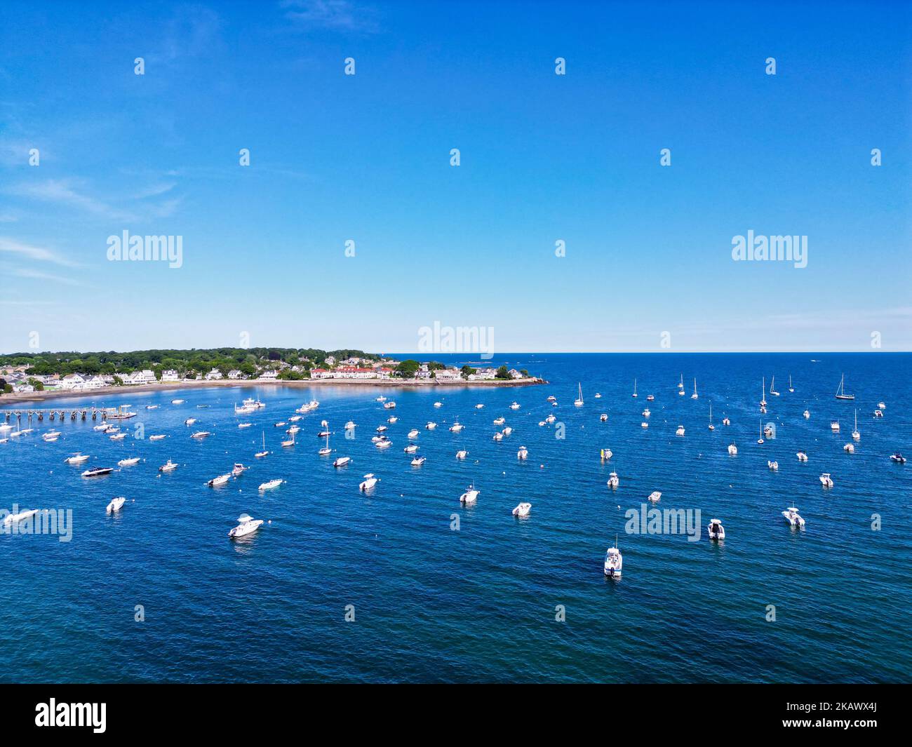 An aerial of small boats on the Lynn beach by the coastal Swampscott ...