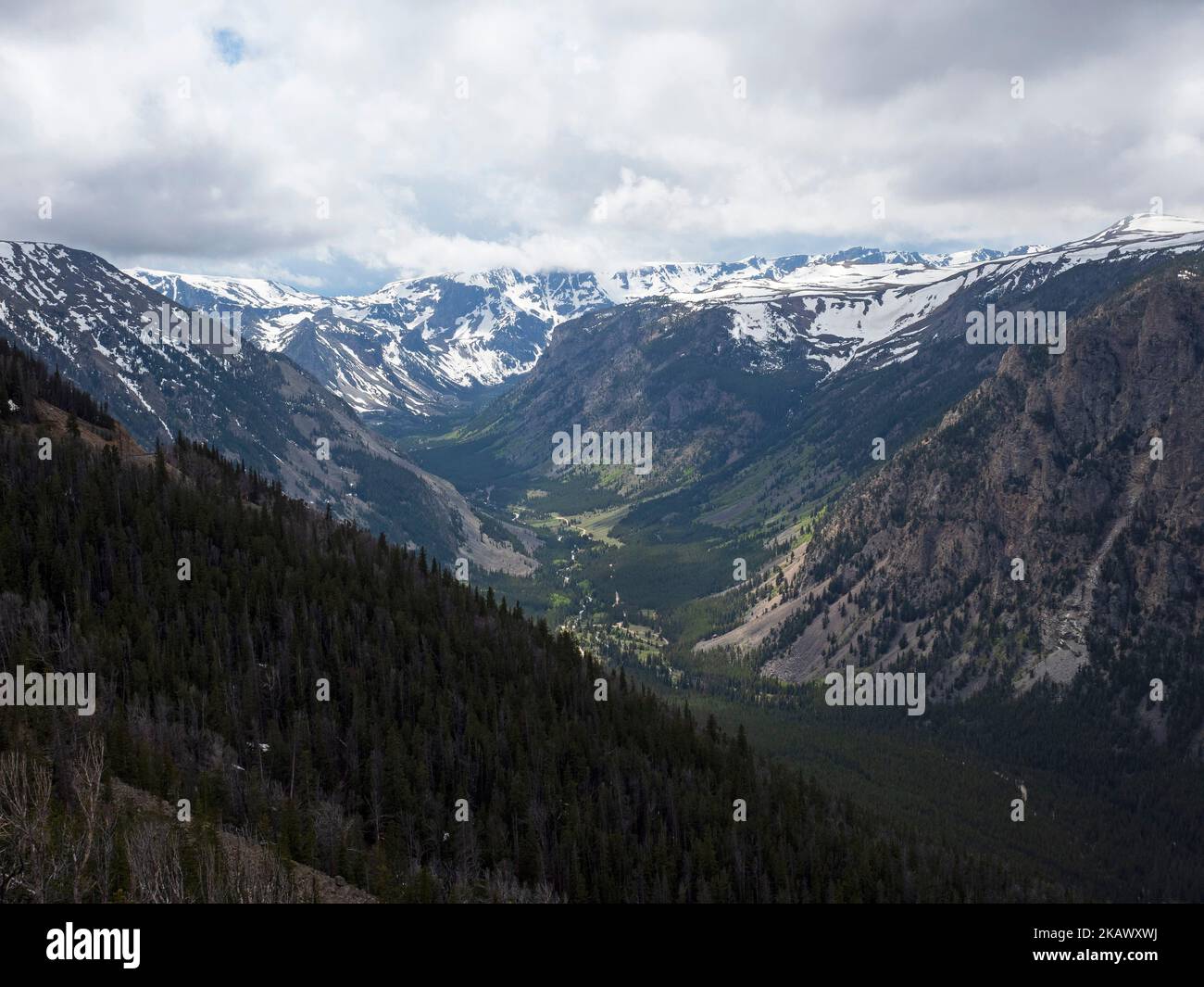 Snow covered mountains and coniferous forest with Rock Creek valley ...