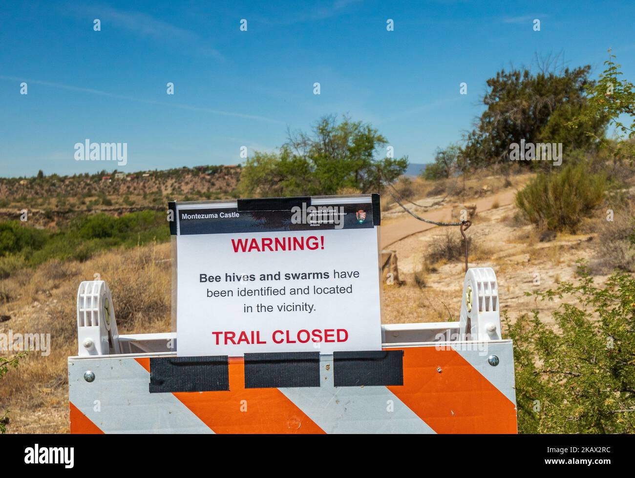A warning sign of closed trail text, Bee swarm near Rimrock, Arizona ...