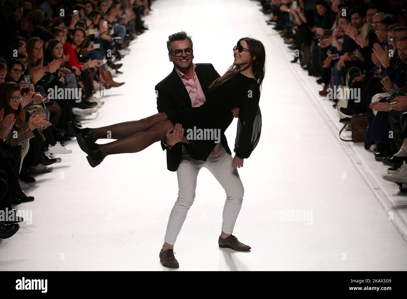 Portuguese fashion designer Filipe Faisca acknowledges cheers after presenting the Fall / Winter ...